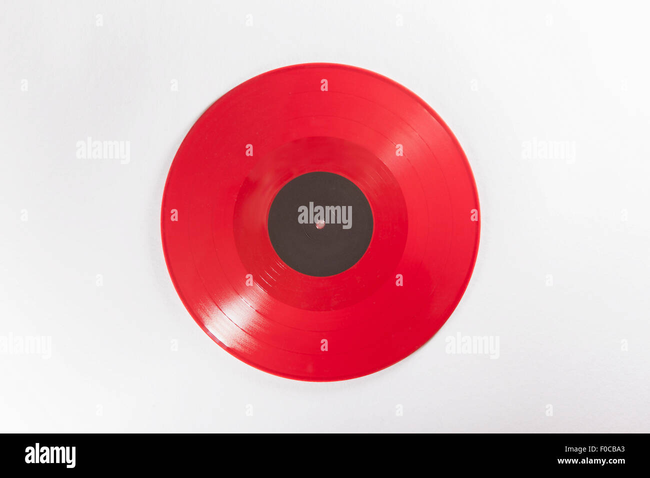 Close-up of red record over white background Stock Photo - Alamy