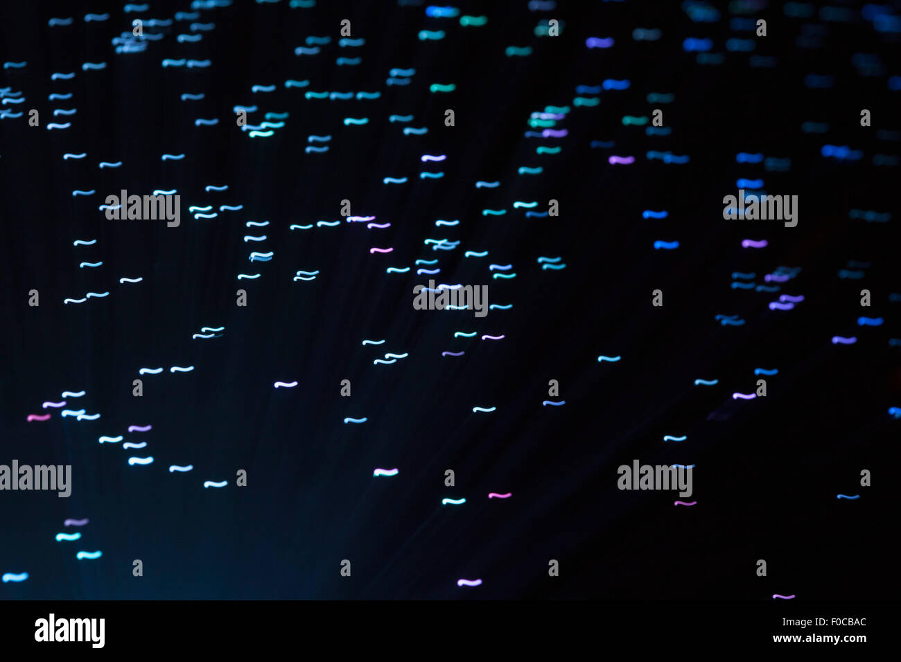 Illuminated fiber optics over black background Stock Photo - Alamy