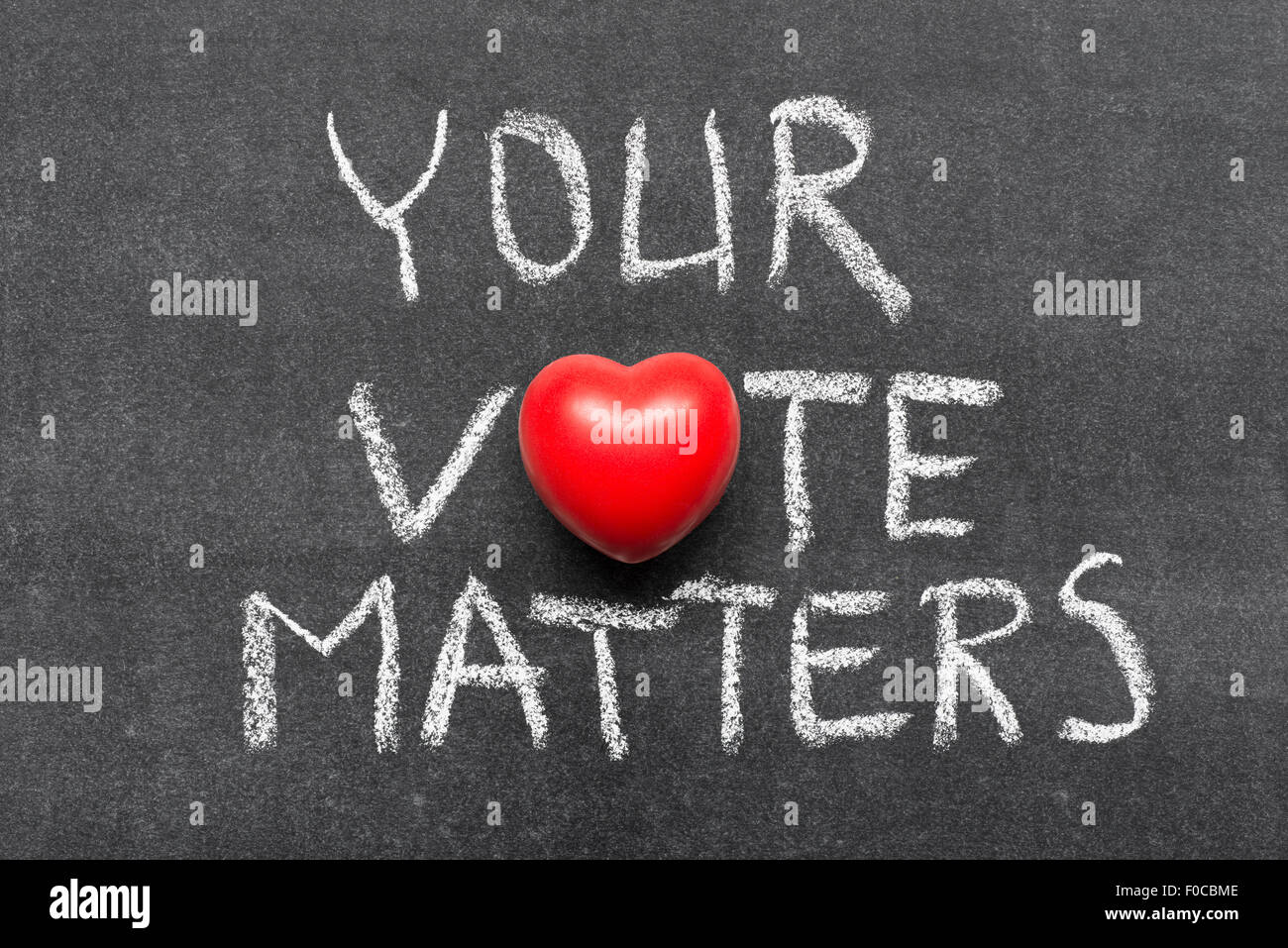 your vote matters phrase handwritten on blackboard with heart symbol ...