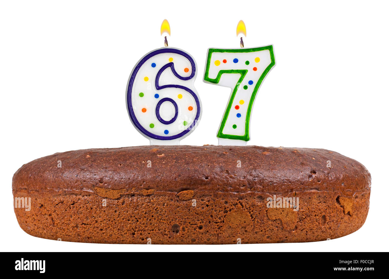 birthday cake with candles number sixty seven isolated on white ...