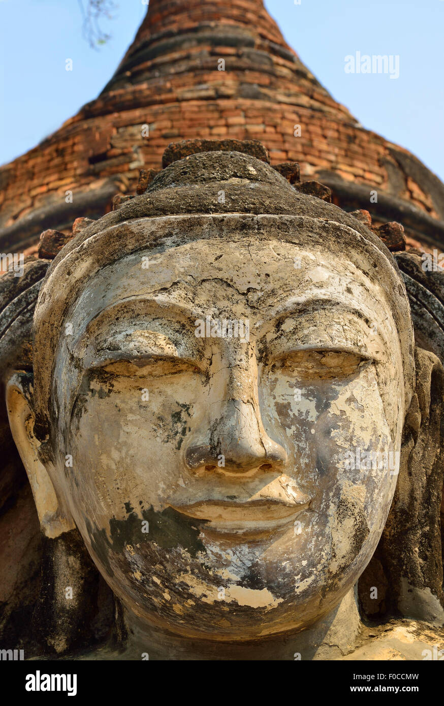 A stone carved Buddha's head at a pagoda near Inwa (Ava), Myanmar ...