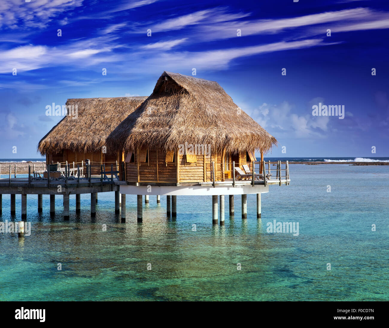 Typical Polynesian landscape -small houses on water Stock Photo - Alamy