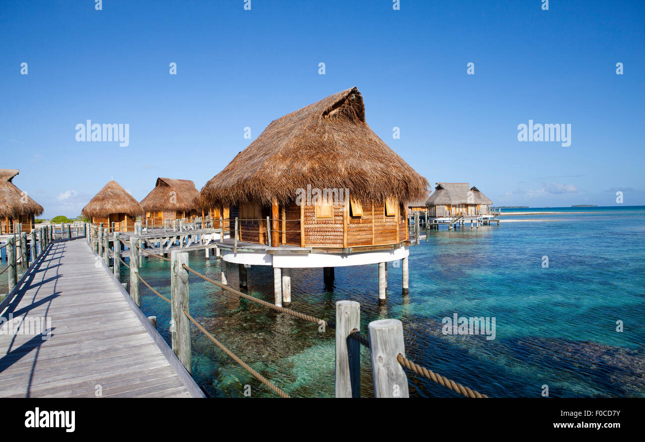 Typical Polynesian landscape -small houses on water Stock Photo - Alamy
