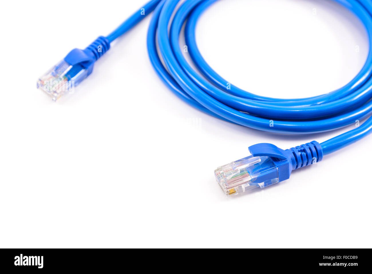Blue network cable isolated on white background Stock Photo - Alamy