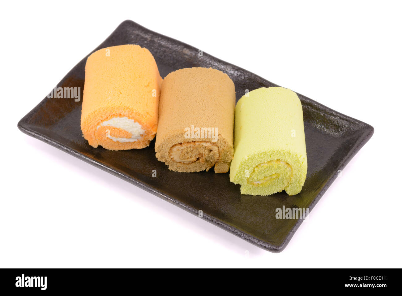 Roll cakes isolated on white background Stock Photo - Alamy