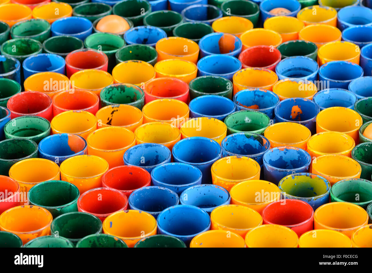 Row colourful glass in green yellow blue red orange Stock Photo - Alamy