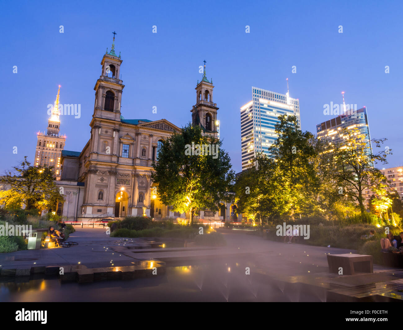 Grzybowski Square (Plac Grzybowski) with All Saints' Church at night ...