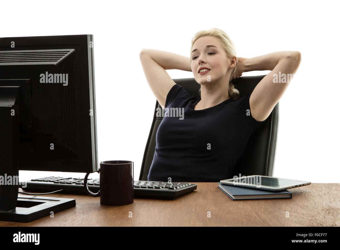 woman siting at her desk resting in her chair Stock Photo - Alamy