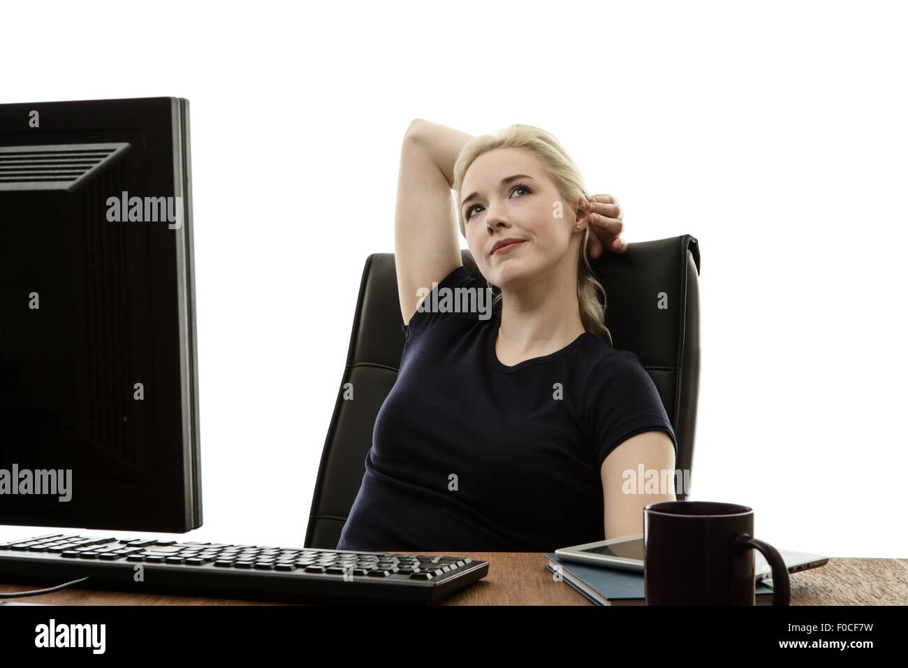 woman siting at her desk resting in her chair Stock Photo - Alamy