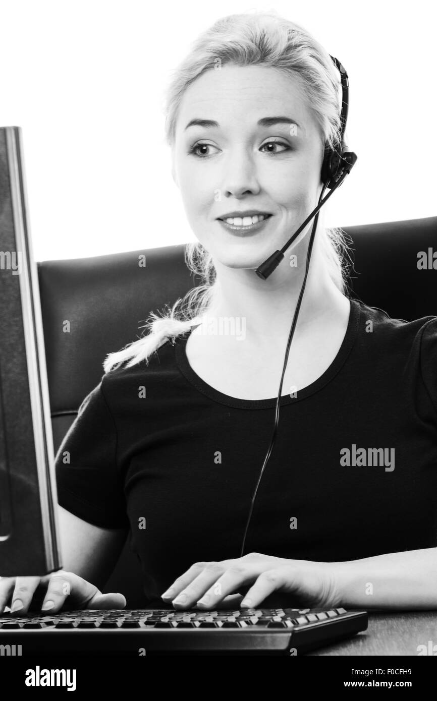 call center woman sitting at her desk on a call Stock Photo - Alamy