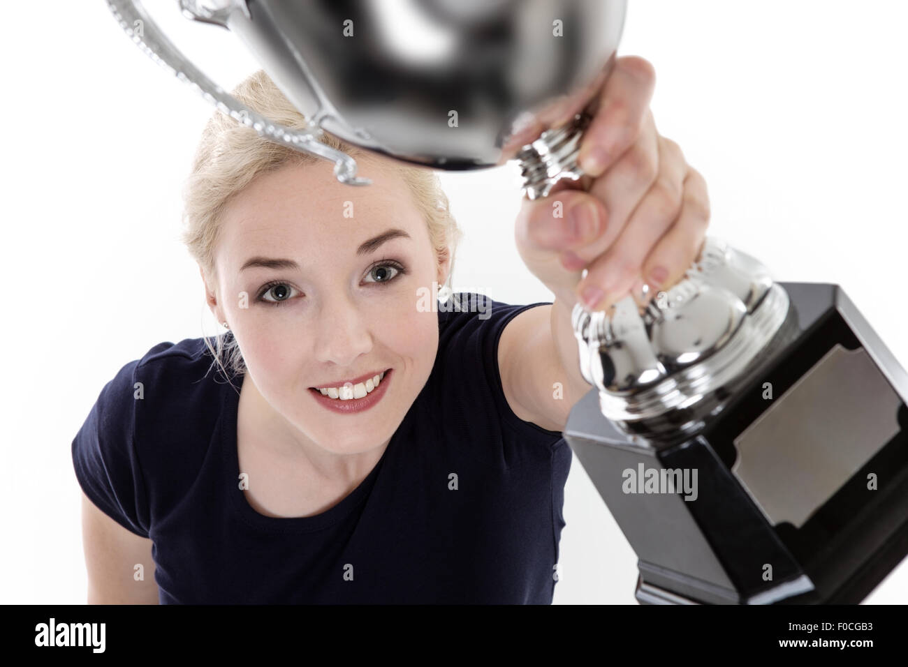 Standing holding trophy achievement holding hands hi-res stock ...