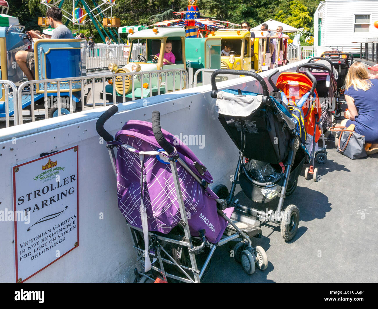 Strollers, Victorian Gardens, Carnival in Central Park, NYC Stock Photo ...