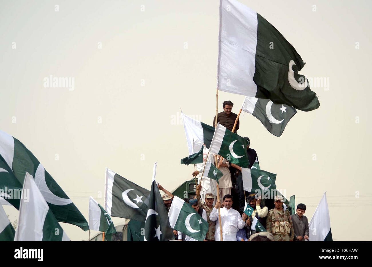 Passenger holding Pakistan's national flags travelling on Azadi Train ...