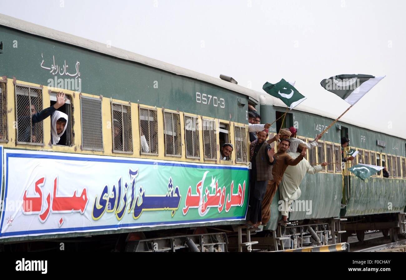 Passenger holding Pakistan's national flags travelling on Azadi Train ...