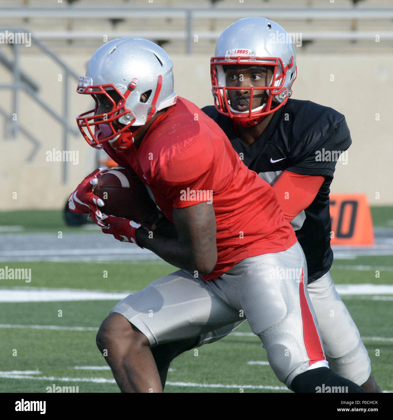 Usa. 11th Aug, 2015. SPORTS -- UNM quarterback Lamar Jordan, right ...