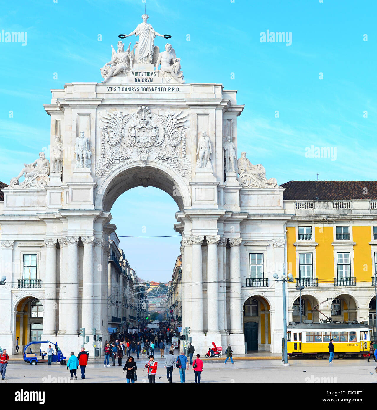 People walking at Rua Augusta Arch on the Commerce Square - tourist ...