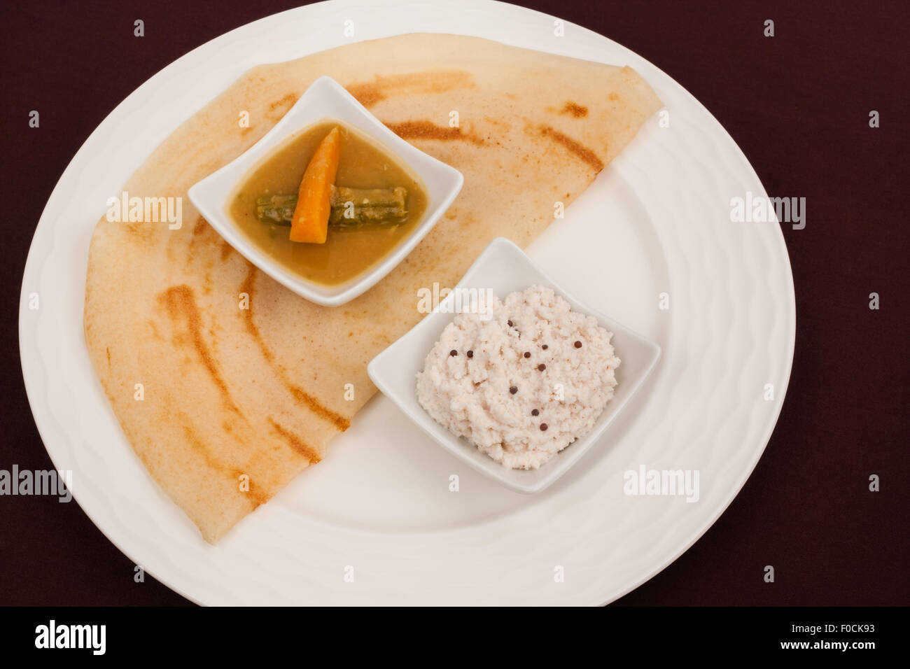 A traditional ethnic south Indian breakfast of Dosa (Dosai) served with ...
