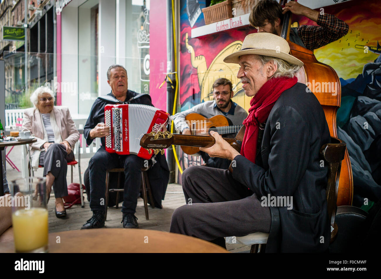 A jazz guitarist performing outside a small jazz club in Ghent (Belgium ...