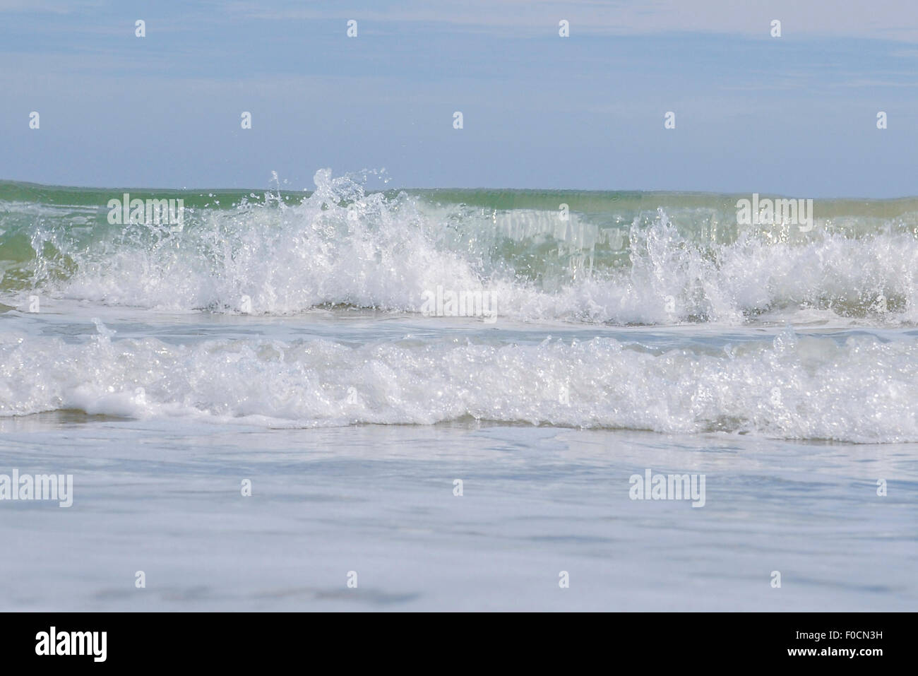 Ocean waves coming ashore Stock Photo - Alamy
