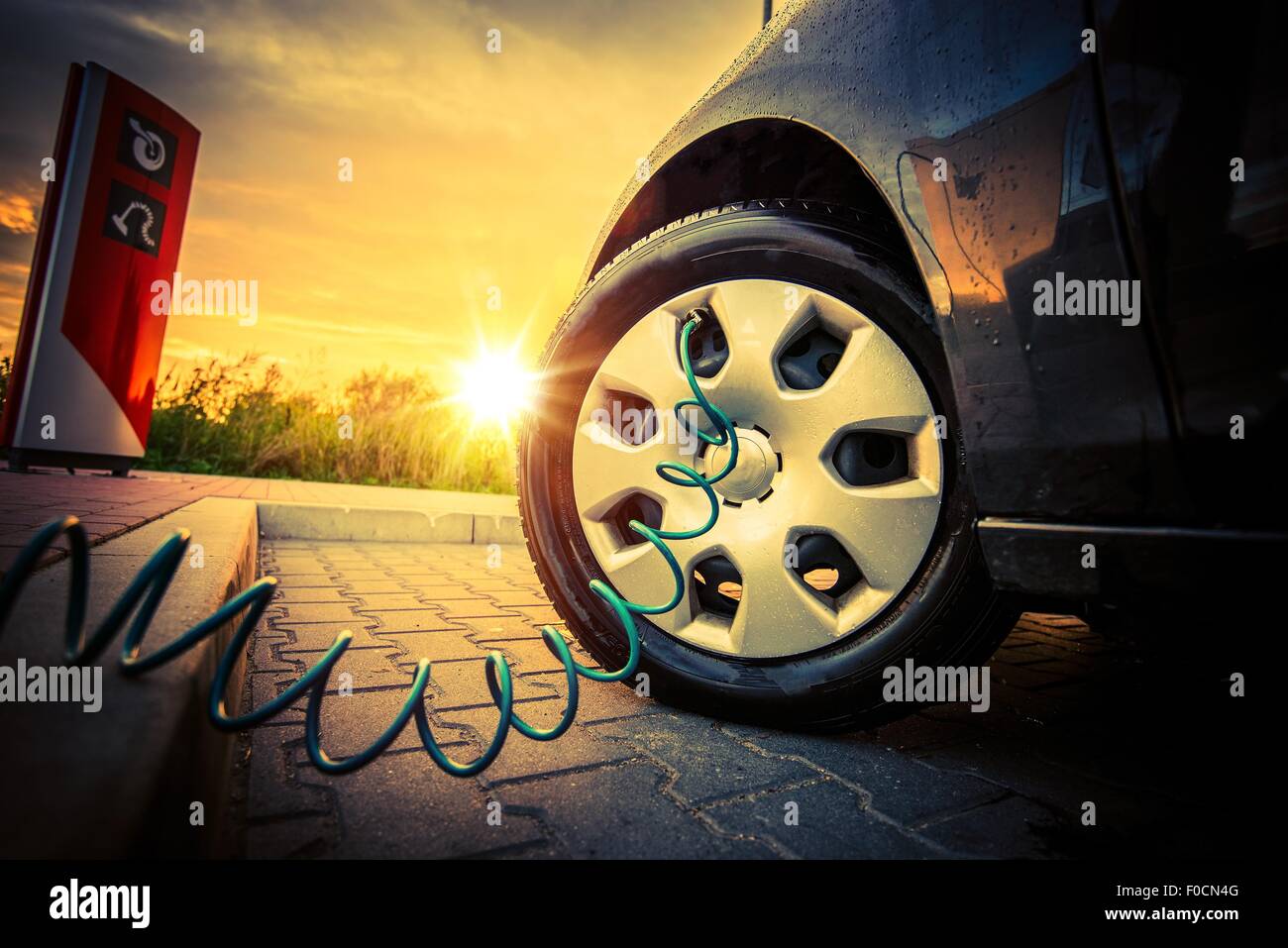 Tire Air Pressure Check at the Check Station During Sunset. Pumping Air ...