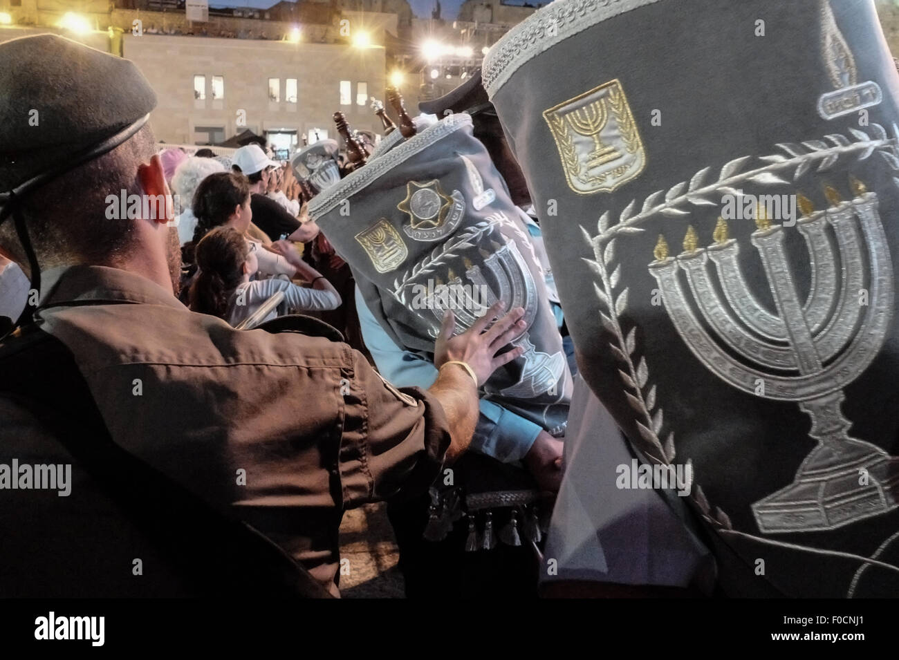 Jerusalem, Israel. 12th August, 2015. Torah scrolls are carried into a ...