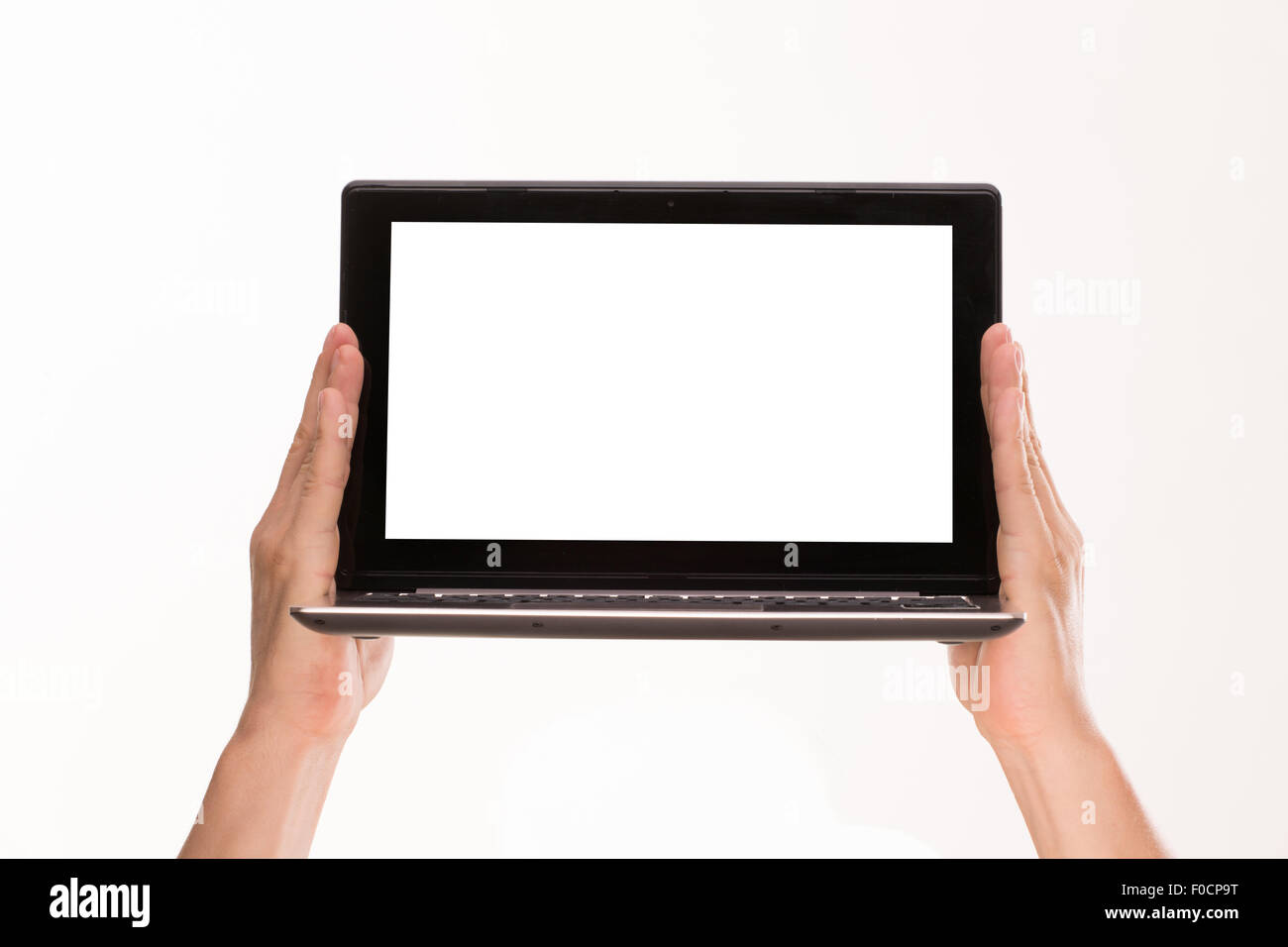 Man's hands holding laptop Stock Photo - Alamy