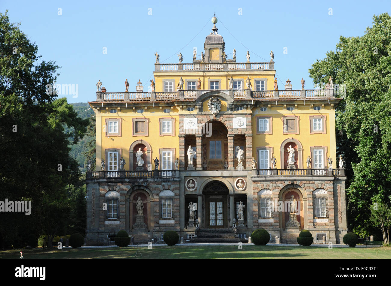 The front facade of the Villa Torrigiani in its distinctive colours ...
