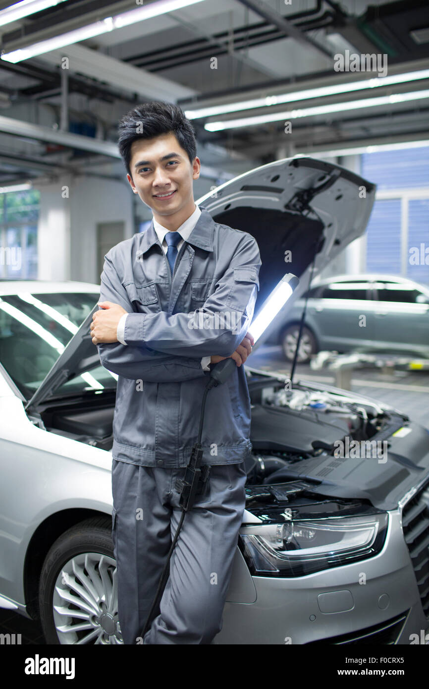 Standing car mechanic transportation industry manufacturing manual ...