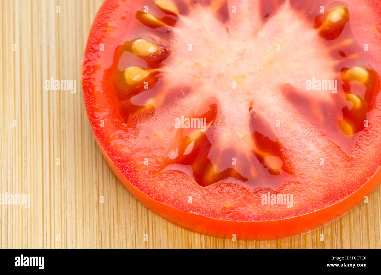 Fresh slice tomato closeup Stock Photo - Alamy