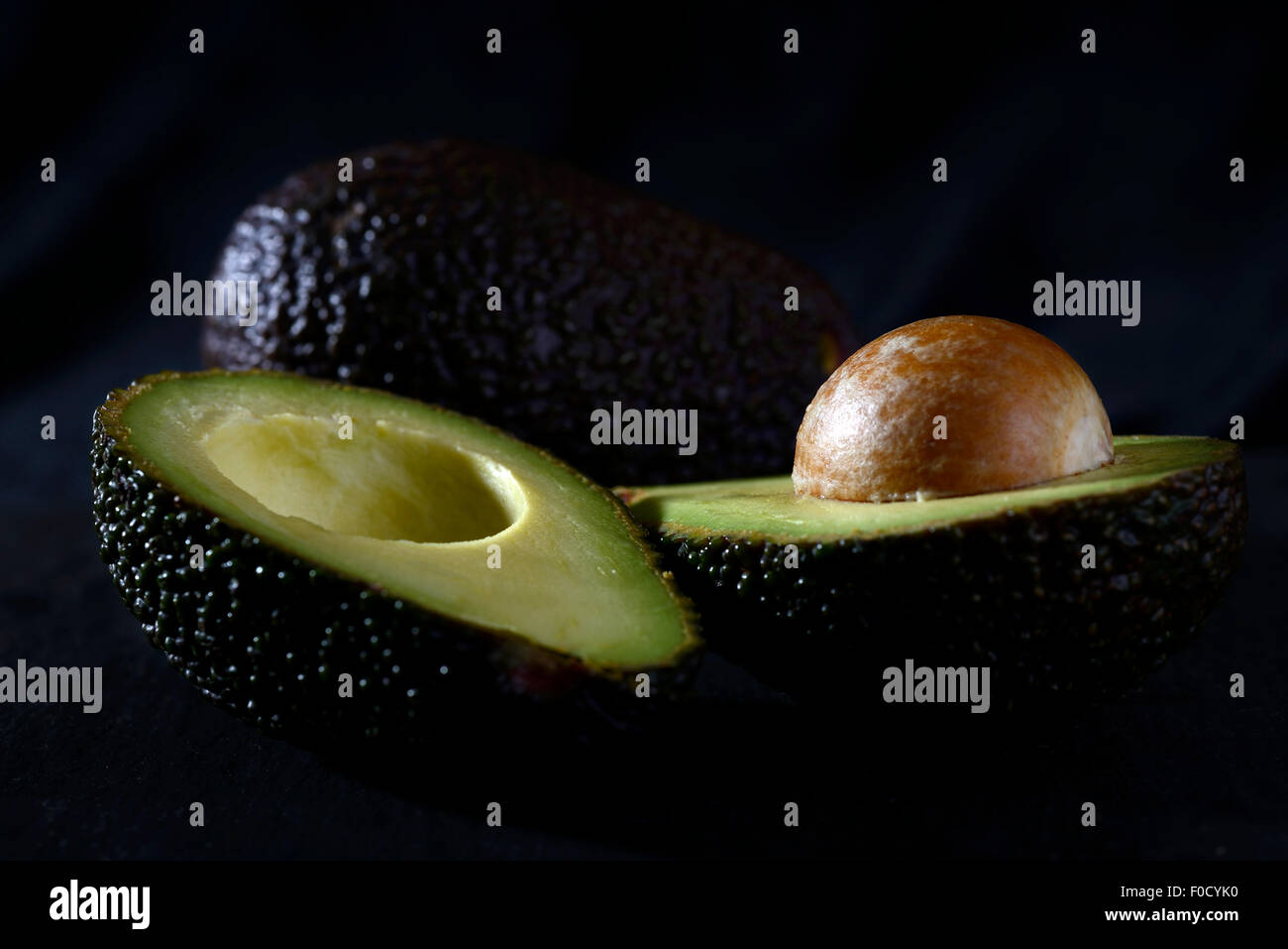 artistic expression of cut open avocados Stock Photo - Alamy