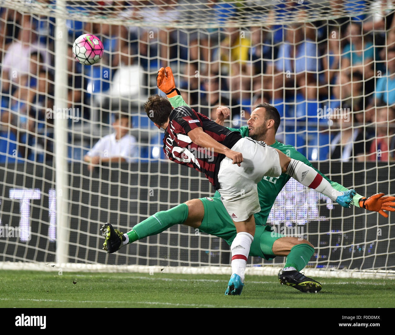 Reggio Emilia, Italy. 12th Aug, 2015. Bertolacci (front) of AC Milan ...