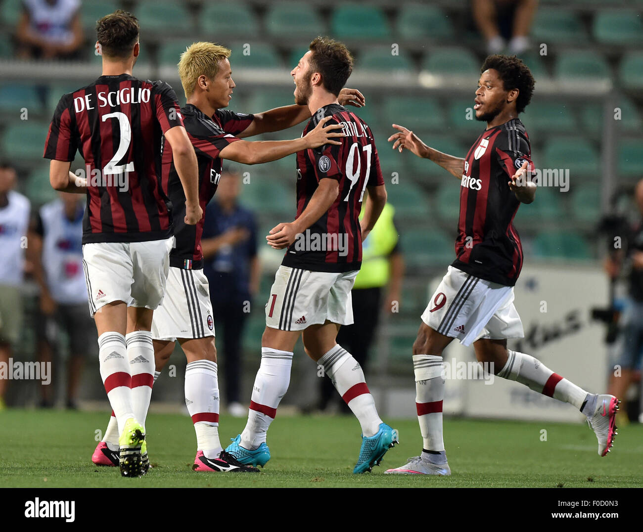 Reggio Emilia, Italy. 12th Aug, 2015. Bertolacci (2nd R) of AC Milan ...