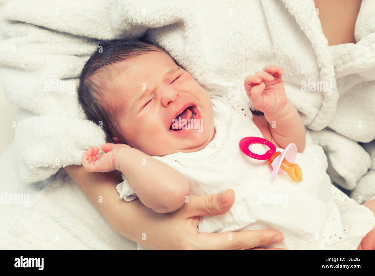 Crying newborn baby Stock Photo - Alamy