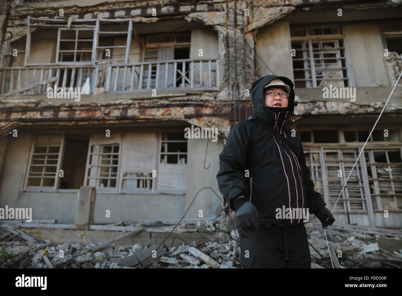 In this December 12, 2013 photo, director Shinji Higuchi walks in front ...