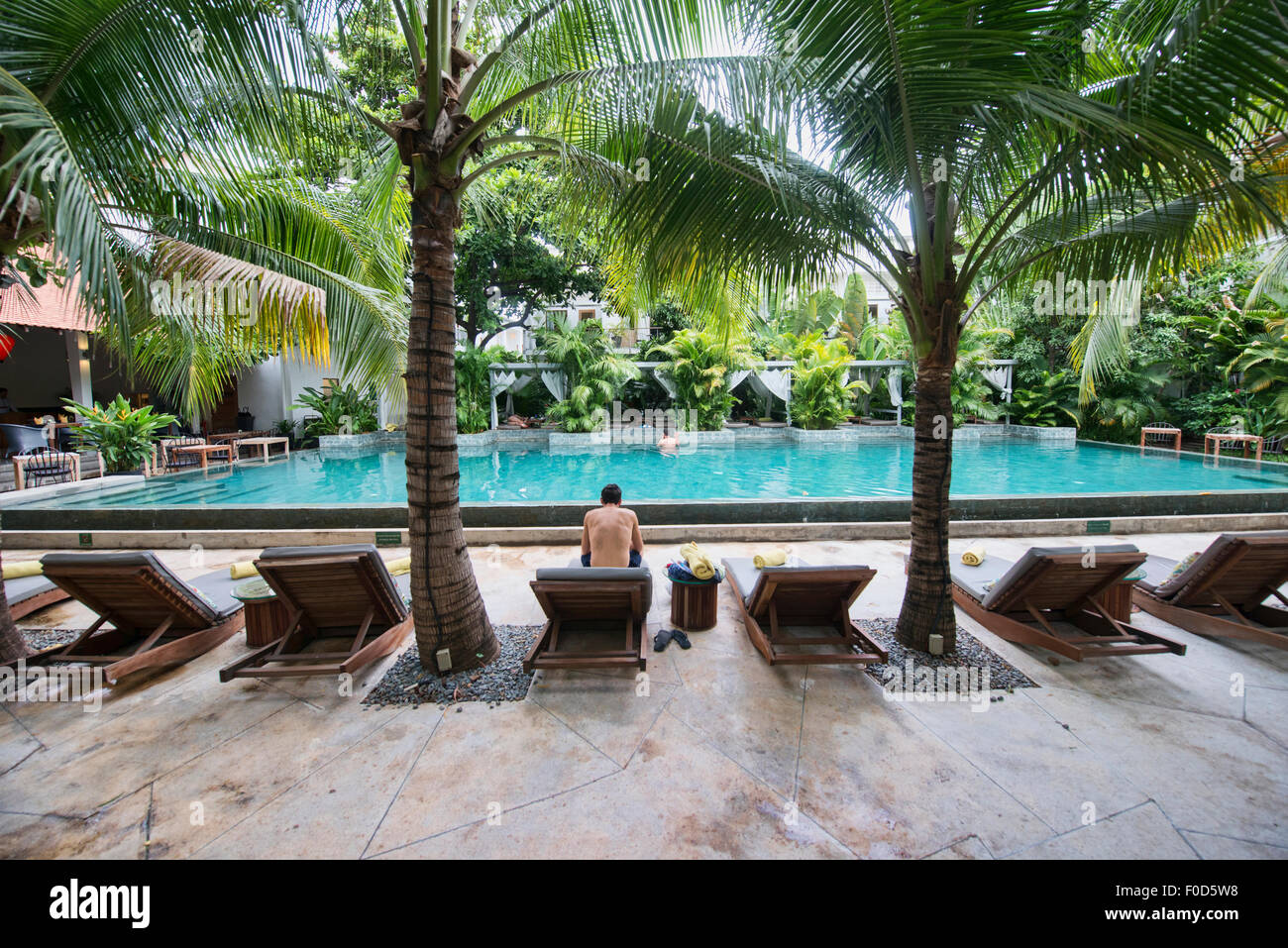 Relaxing by the pool at the Plantation Resort in Phnom Penh, Cambodia ...
