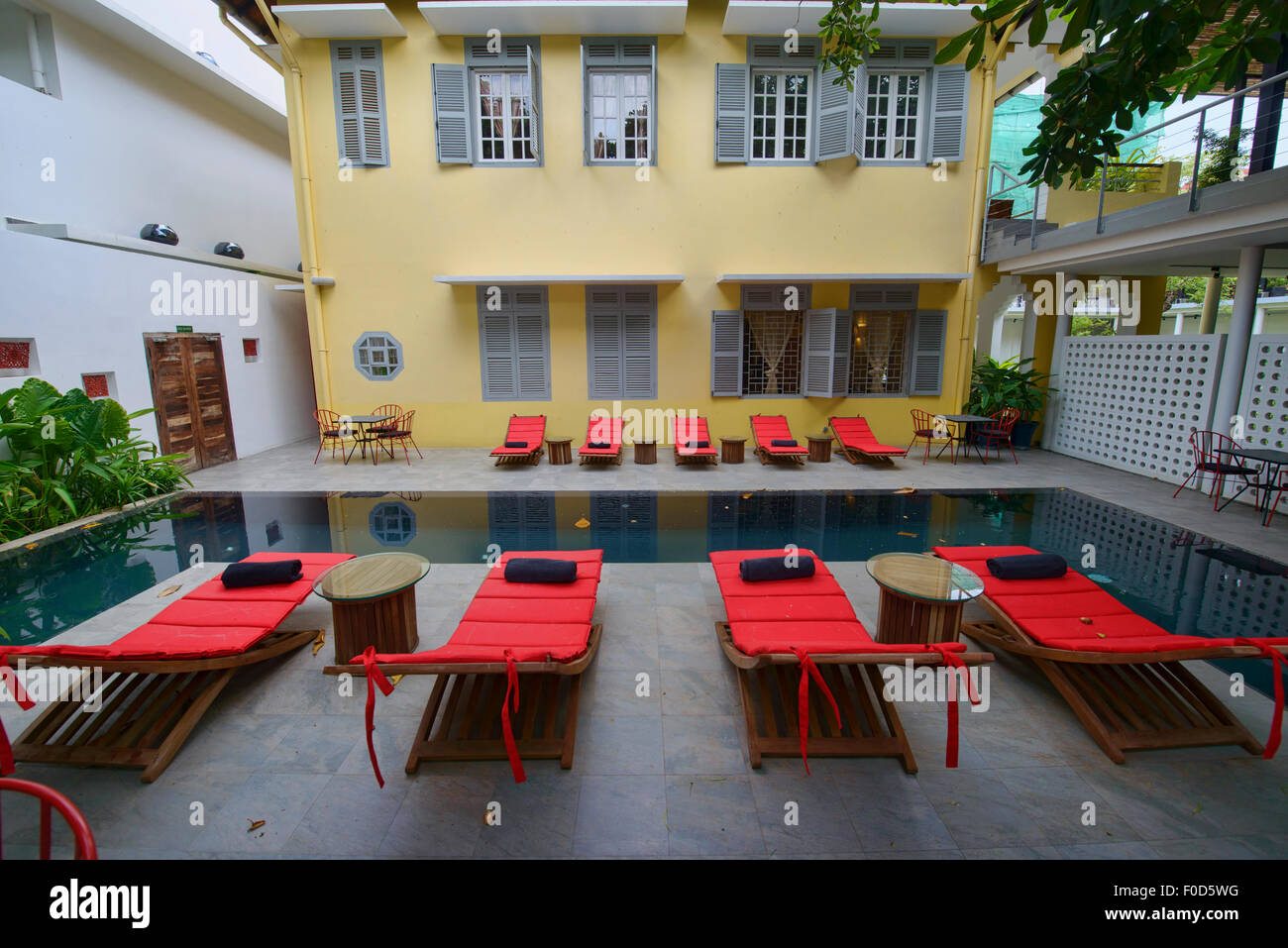 Relaxing by the pool at the Plantation Resort in Phnom Penh, Cambodia ...