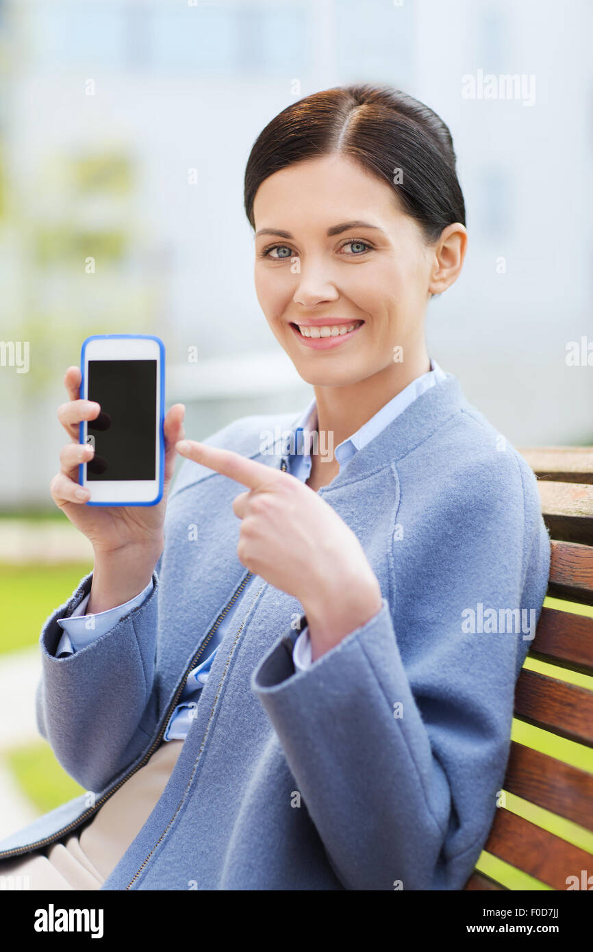 young smiling businesswoman showing smartphone Stock Photo - Alamy