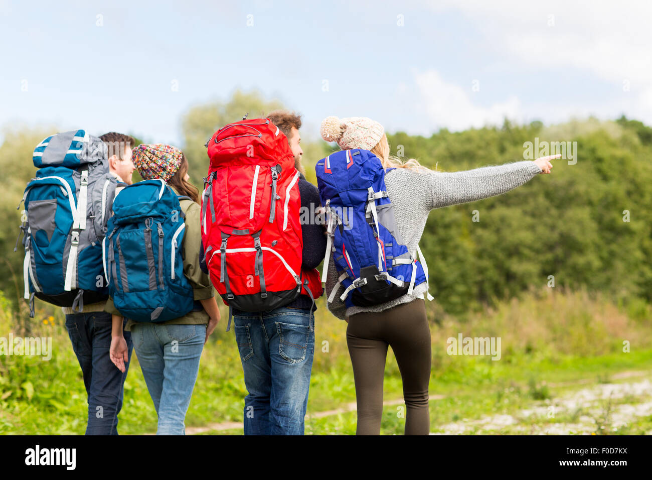 group of friends with backpacks hiking Stock Photo - Alamy