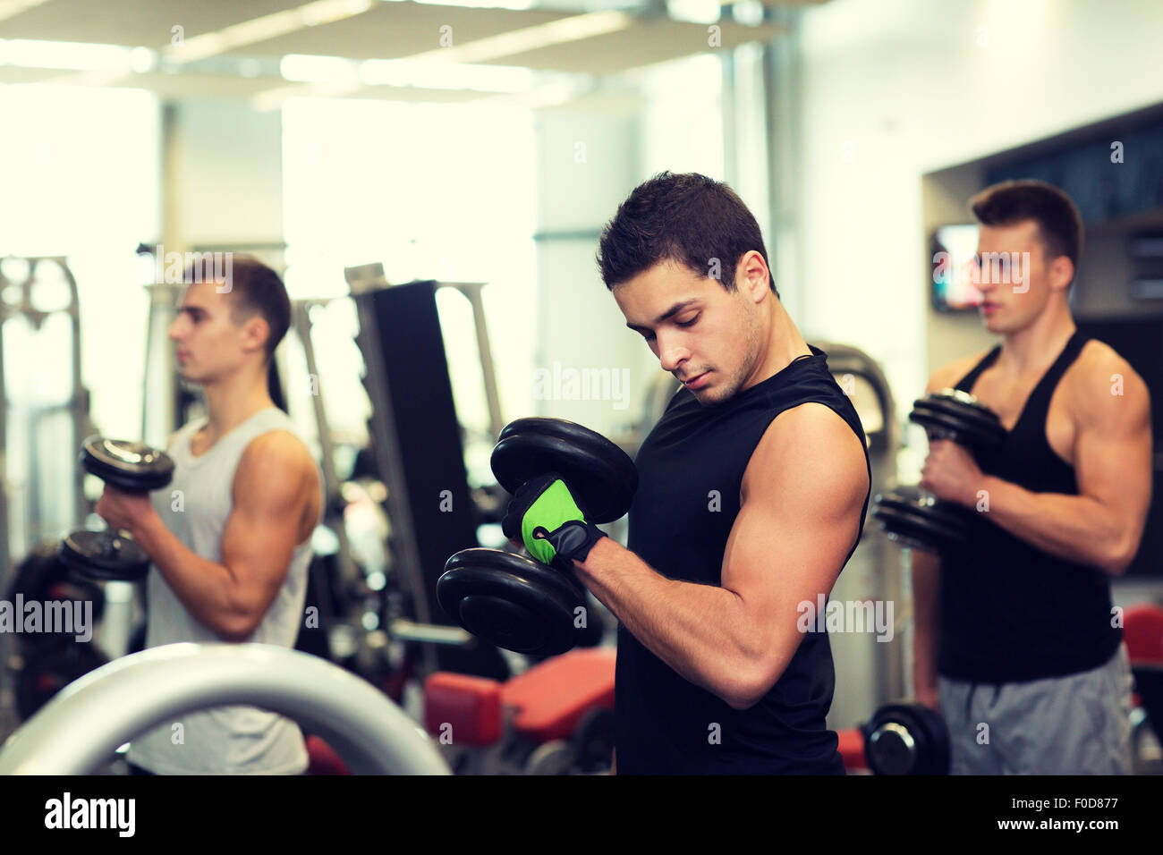 Group Of Men Lifting Weights