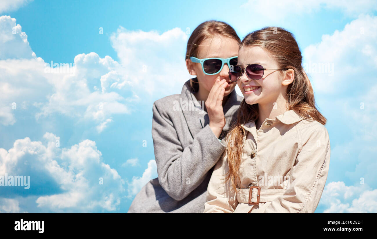 happy girl whispering secret to her friends ear Stock Photo - Alamy