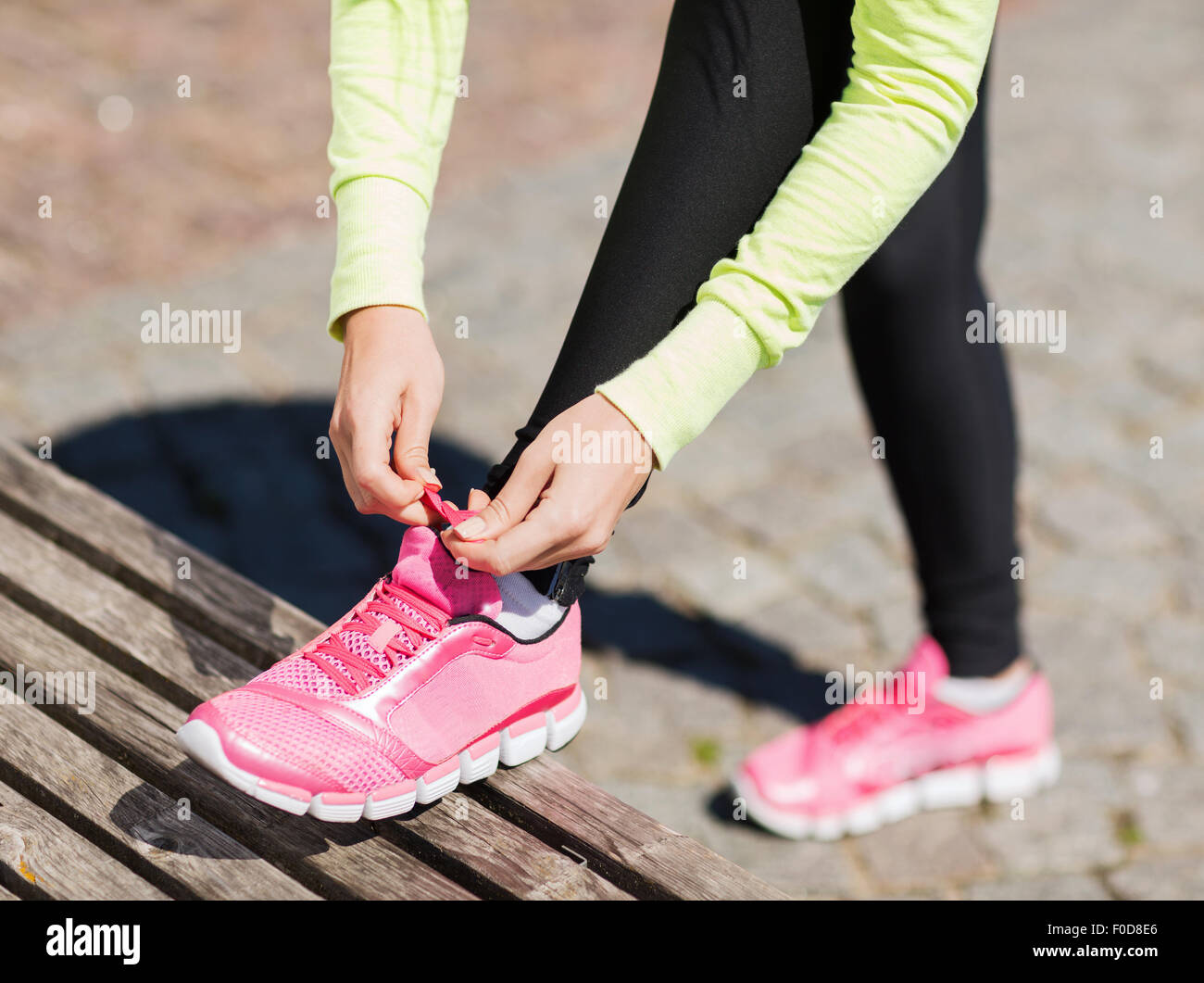 Tieing her shoes hi-res stock photography and images - Alamy