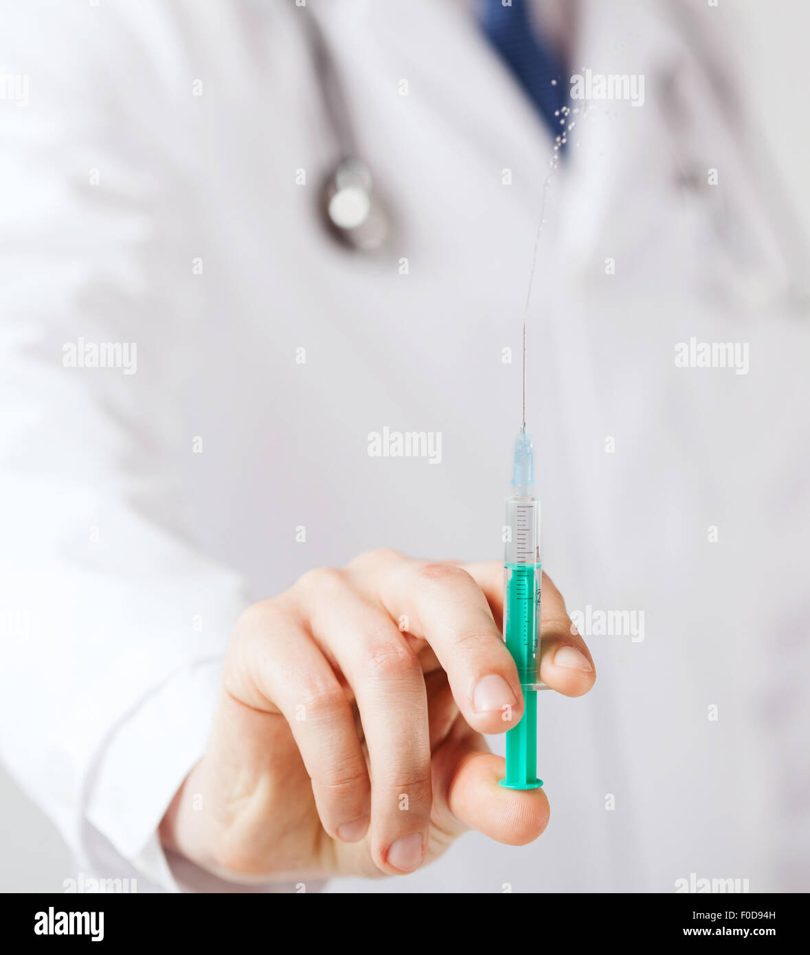 male hand holding syringe with injection Stock Photo - Alamy