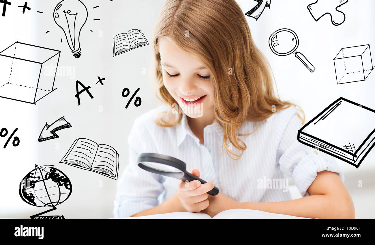 girl reading book with magnifier at school Stock Photo - Alamy
