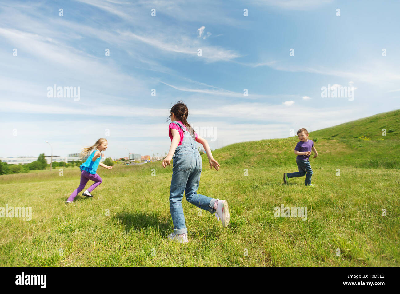 group of happy kids running outdoors Stock Photo - Alamy