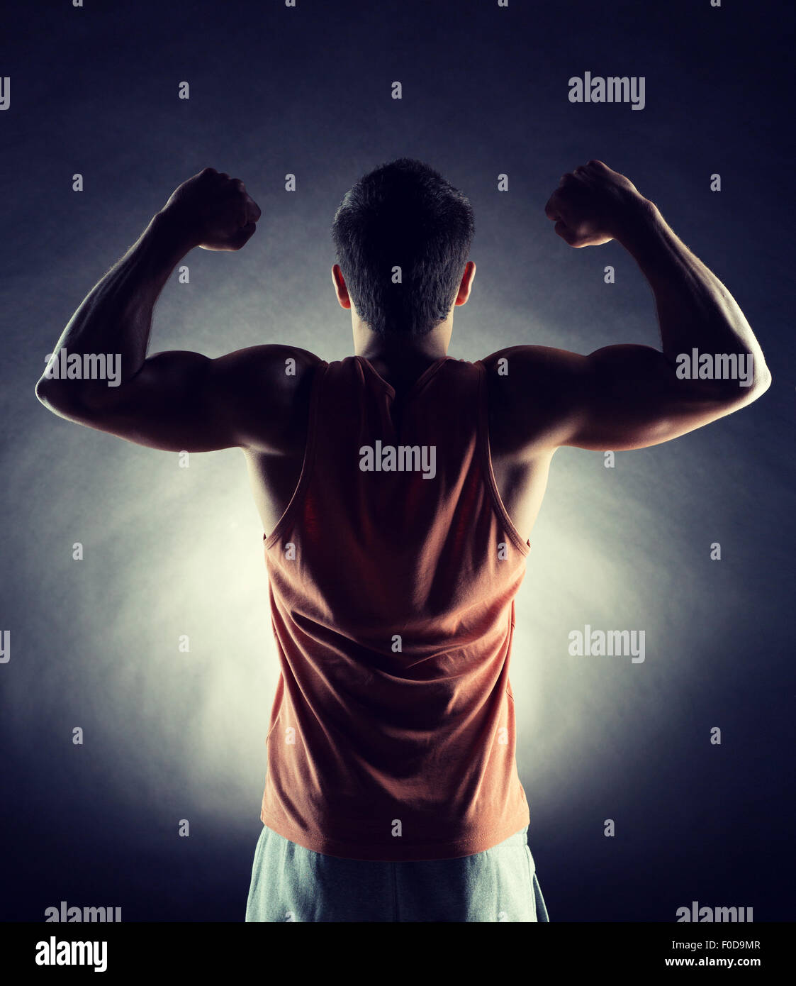 young man showing biceps Stock Photo - Alamy