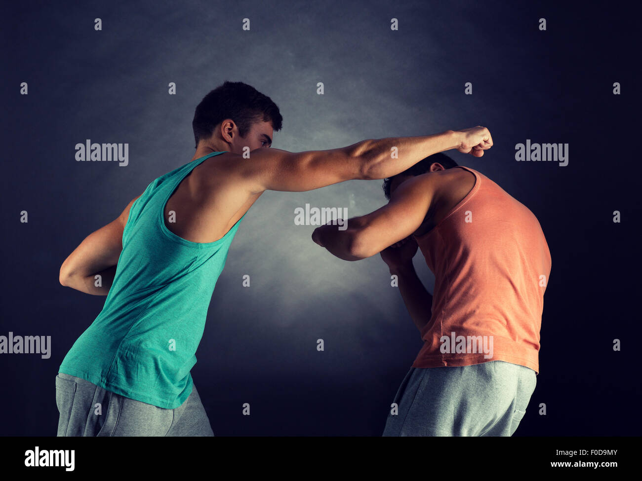 young men wrestling Stock Photo - Alamy