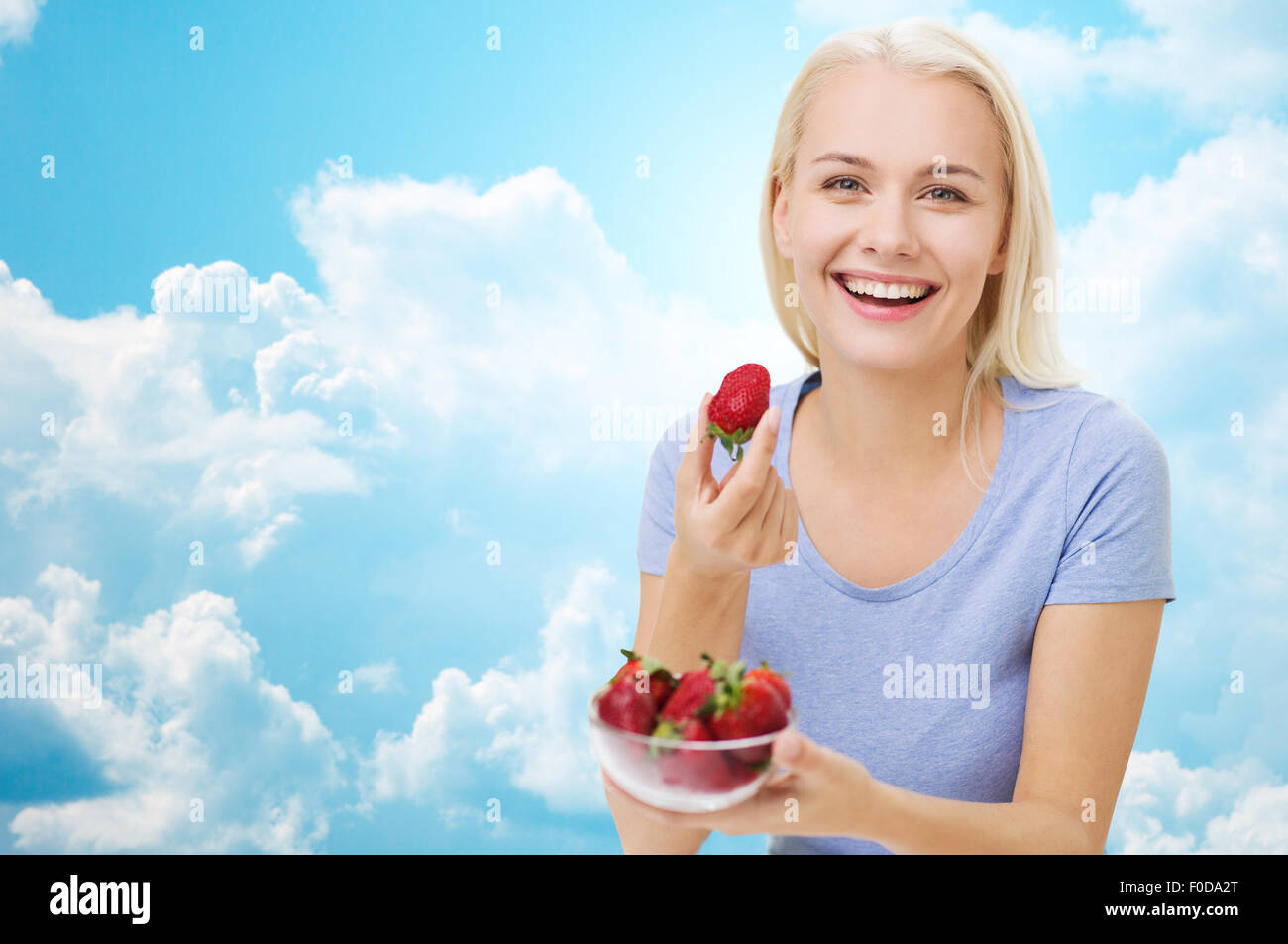 Woman eating berries hi-res stock photography and images - Alamy