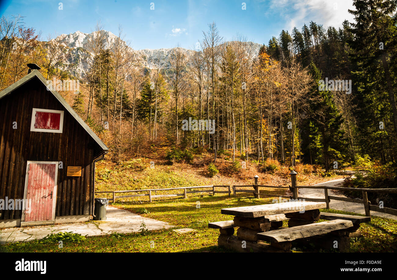 Alpine hut with a bench in the italian alps Stock Photo - Alamy