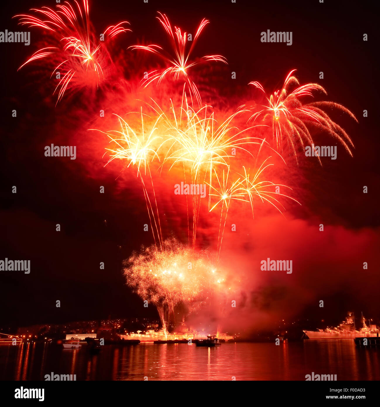 Red colorful fireworks on the black sky background Stock Photo - Alamy