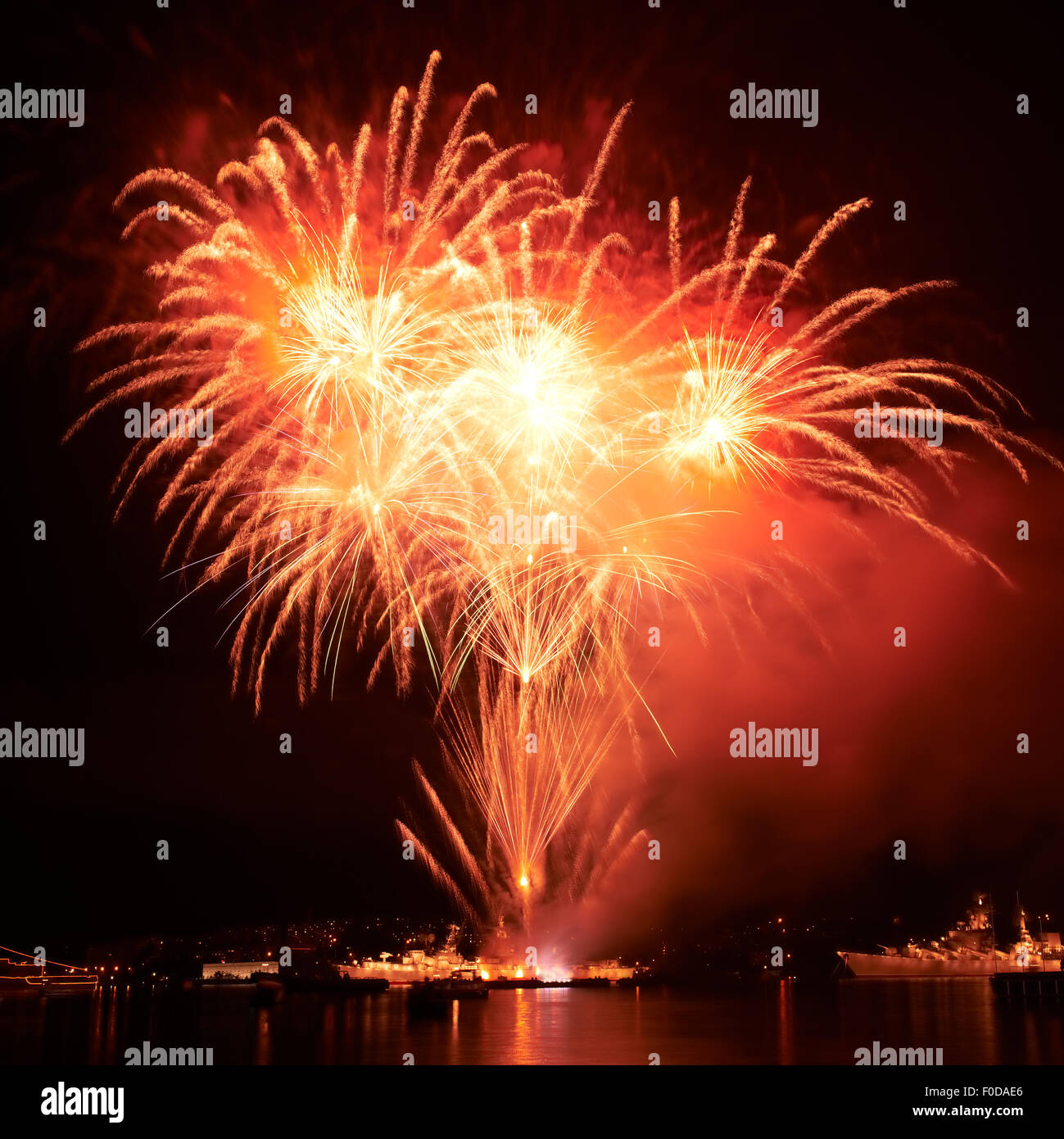 Red colorful fireworks on the black sky background Stock Photo - Alamy